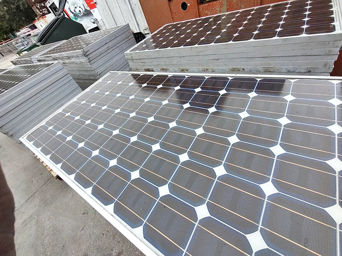 Solar panels basking in Florida sunshine before finding new homes. Renewable energy solutions waiting for the right visionary to put them to work. 