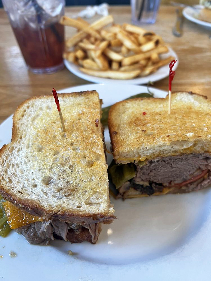 The sandwich that answers the eternal question: "How many delicious things can you stack between two perfectly toasted slices of bread?"