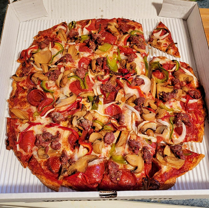 Loaded specialty pizza that proves more can be more when every topping knows its place.
