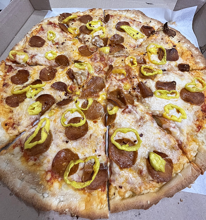 Even vegans get the royal treatment with plant-based cheese, pepperoni, and enough peppers to make your forehead glisten with joy.