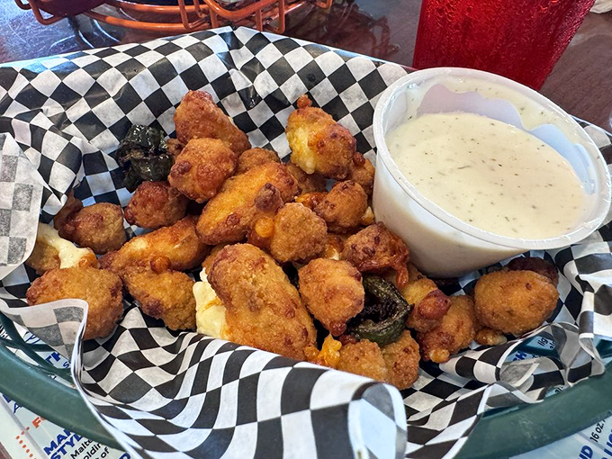 These aren't your average cheese curds &ndash; they're little nuggets of fried happiness with a spicy kick that'll have you plotting your next visit before finishing.