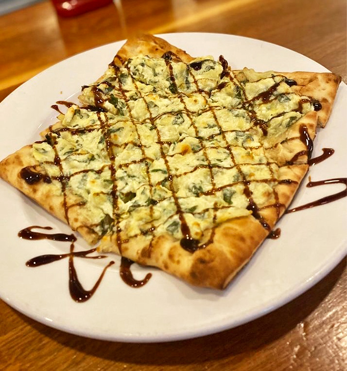 Spinach flatbread drizzled with balsamic creates an artful masterpiece you'll devour without guilt.