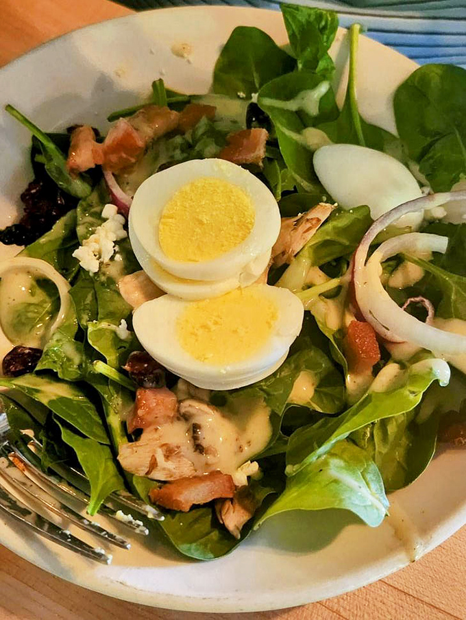 A spinach salad that makes eating greens feel like an indulgence rather than a obligation&mdash;proof that vegetables can party too.