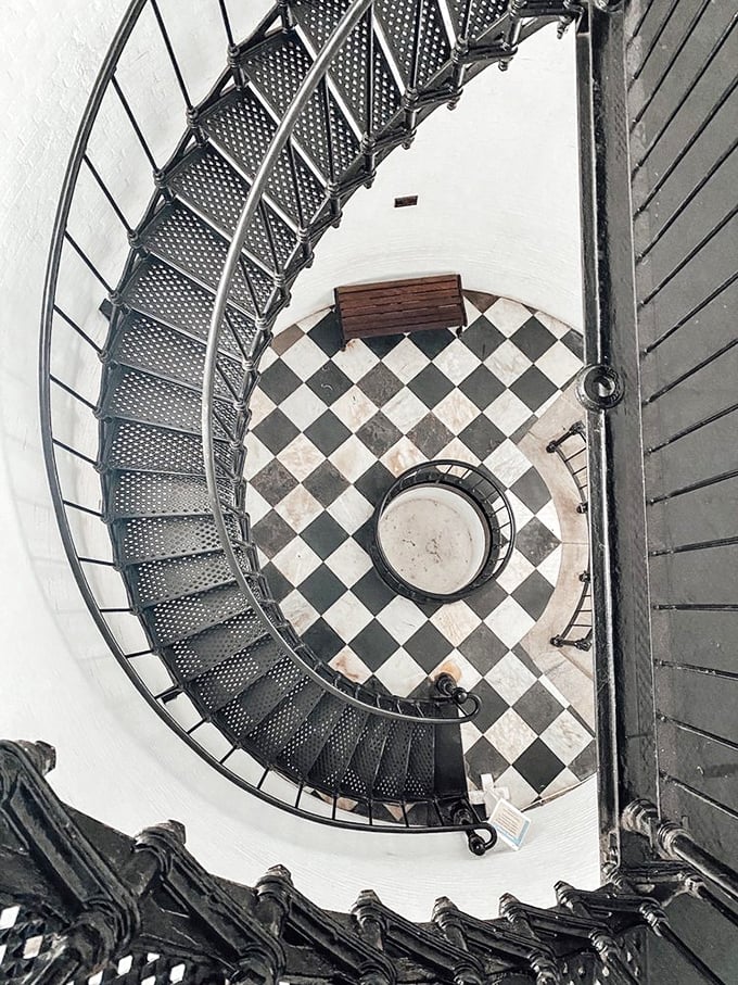 The spiral staircase winds upward like a nautical DNA strand, each of its 219 steps a small piece of the journey to that spectacular view.