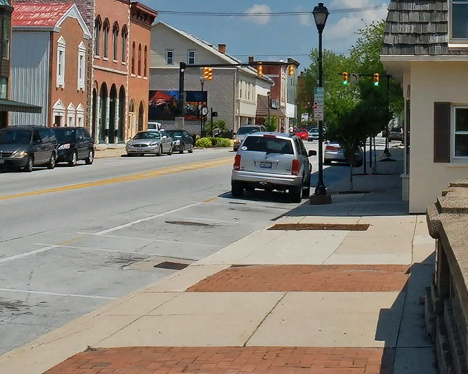 Spring Street showcases the walkable scale of St. Marys, where errands become pleasant strolls rather than stress-inducing commutes through gridlocked traffic.