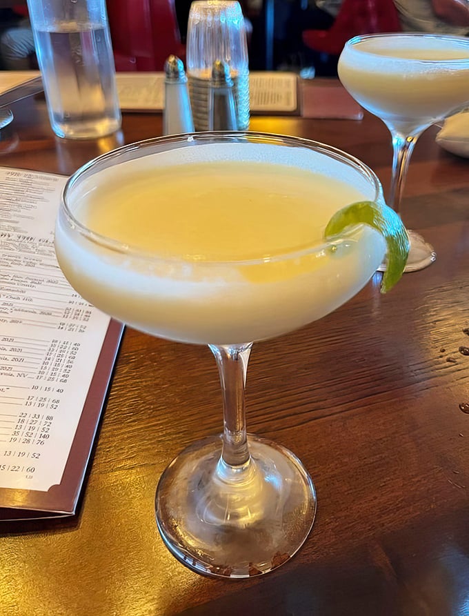 This cocktail isn't just refreshing—it's a vacation in a glass, with that lime wedge serving as your passport to relaxation.