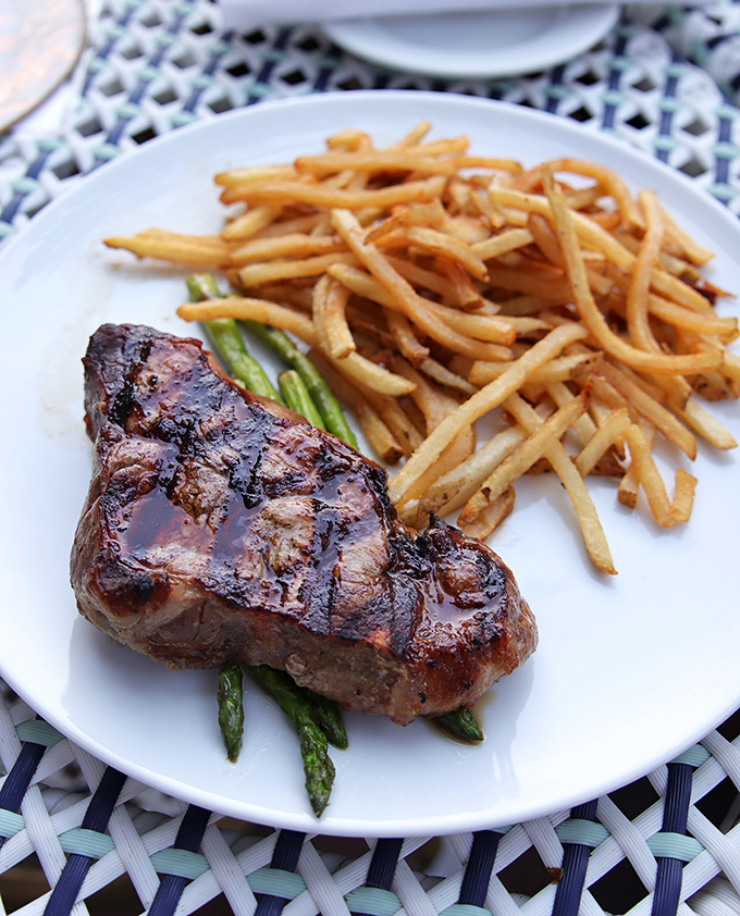 A perfectly seared steak alongside frites that could make a Parisian weep. This is the plate that turns Tuesday into a celebration.
