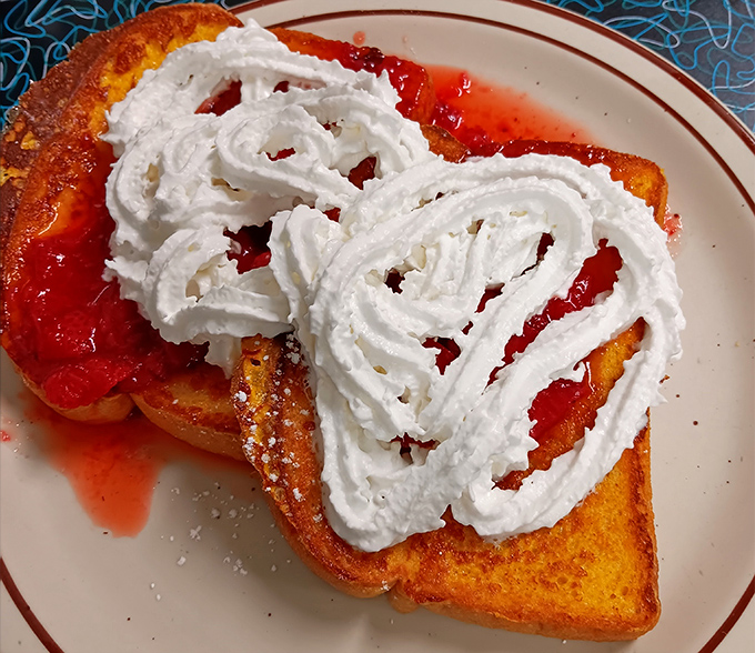 Strawberry French toast that's basically dessert masquerading as breakfast. The whipped cream heart says, "Yes, this is absolutely a legitimate morning meal."