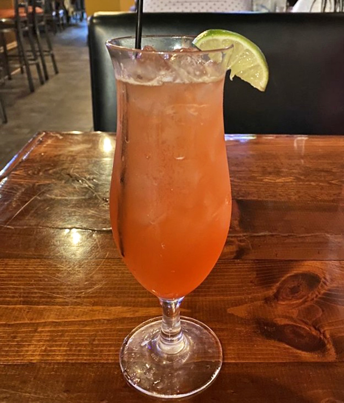A cocktail that looks like a Pittsburgh sunset and kicks like a Steelers linebacker. The perfect companion to spicy Southern fare.