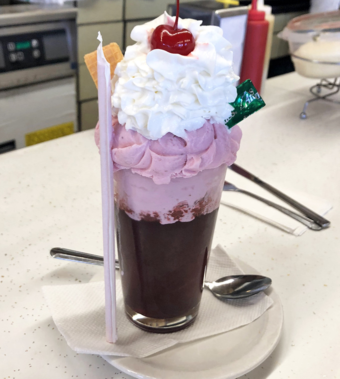 This isn't just a strawberry soda&mdash;it's a three-act play of ice cream, whipped cream, and cherry, with a straw standing by for the grand finale.