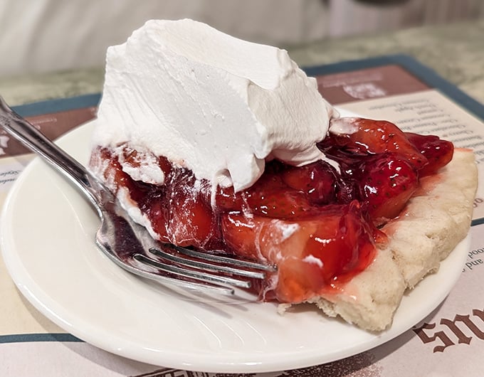 Strawberry pie with whipped cream so fresh and vibrant, it's like summer decided to throw a party on your plate.