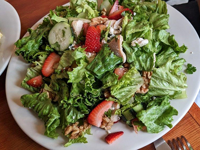 A salad that doesn't apologize for being healthy. Those strawberries and greens are having the kind of party your doctor would actually approve of.