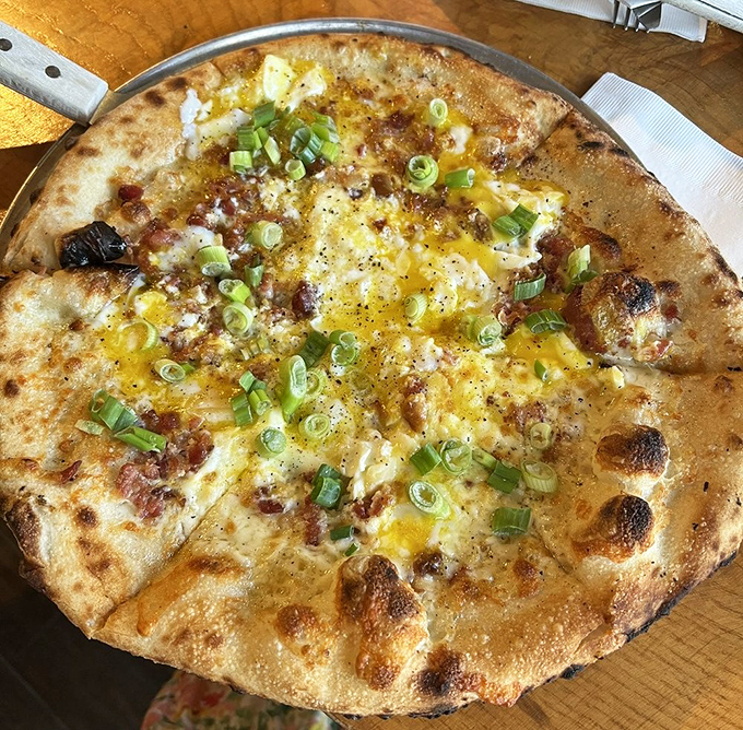 Breakfast meets dinner in this sunny-side-up pizza where the runny yolk creates nature's perfect sauce.