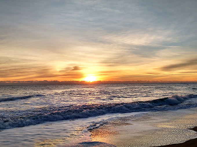 Mother Nature showing off at sunset, painting the sky in impossible colors that make even the most jaded beachgoers stop and stare.