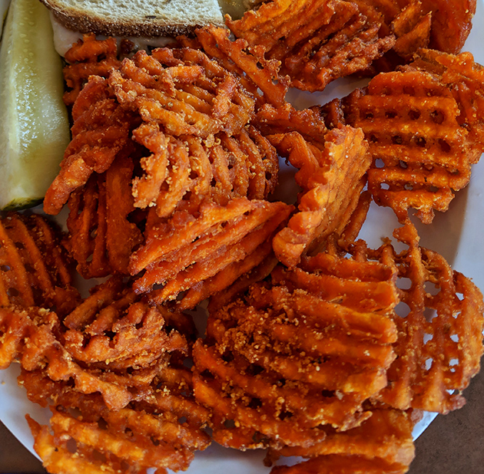 Sweet potato waffle fries that make regular fries question their life choices &ndash; crispy, seasoned, and impossible to stop eating once you start.