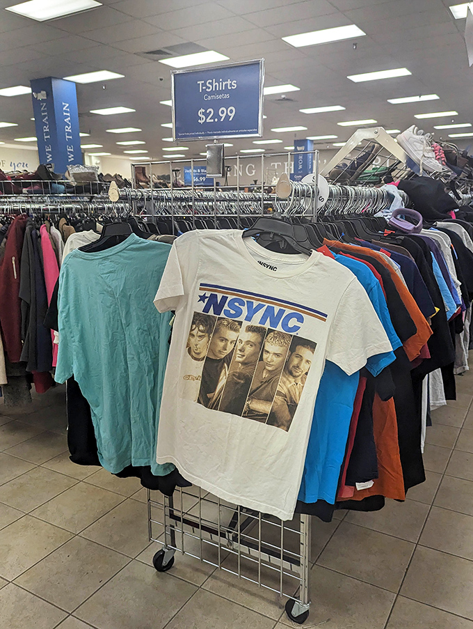 The holy grail for nostalgic fashion hunters—an NSYNC t-shirt hanging among modern castoffs, waiting for a millennial to squeal with delight or a Gen-Xer to roll their eyes.