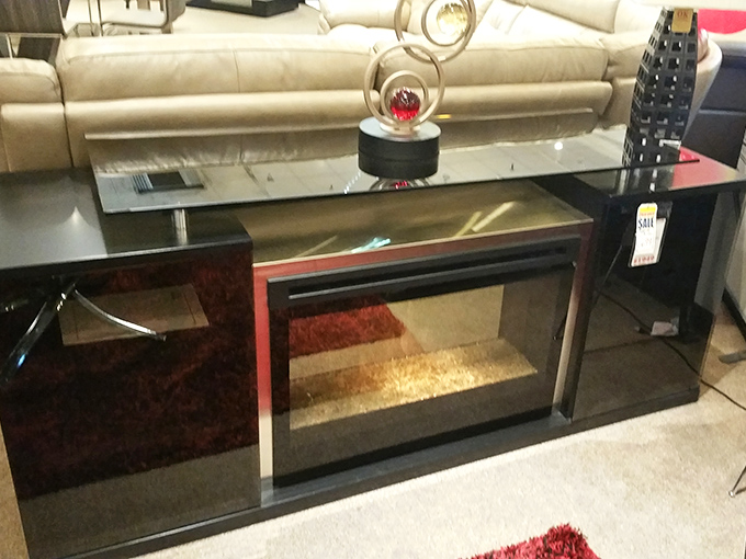 Sleek lines and reflective surfaces make this entertainment center a modern standout. Perfect for hiding all those streaming devices.