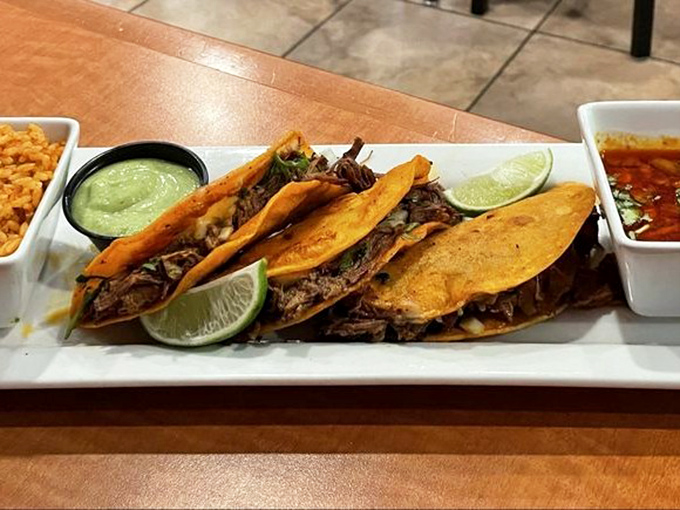 These tacos aren't just filled, they're architectural masterpieces &ndash; perfectly balanced with meat, lime, and those little cups of accompaniments that make life worth living.