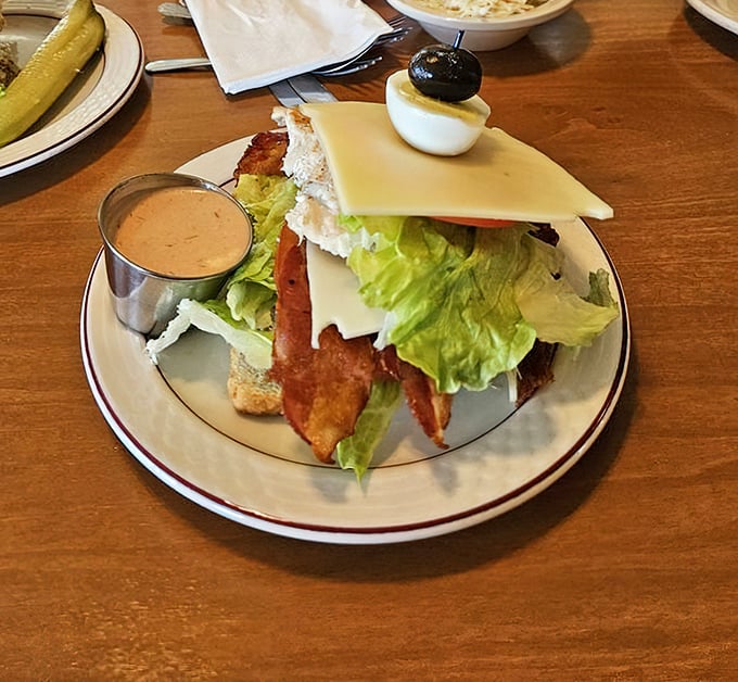 Even the sandwiches get the royal treatment, complete with a pickle spear standing guard like it's protecting treasure.