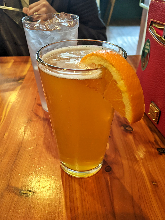 A craft beer with an orange slice &ndash; because sometimes your palate needs a refreshing intermission between acts of meat consumption.