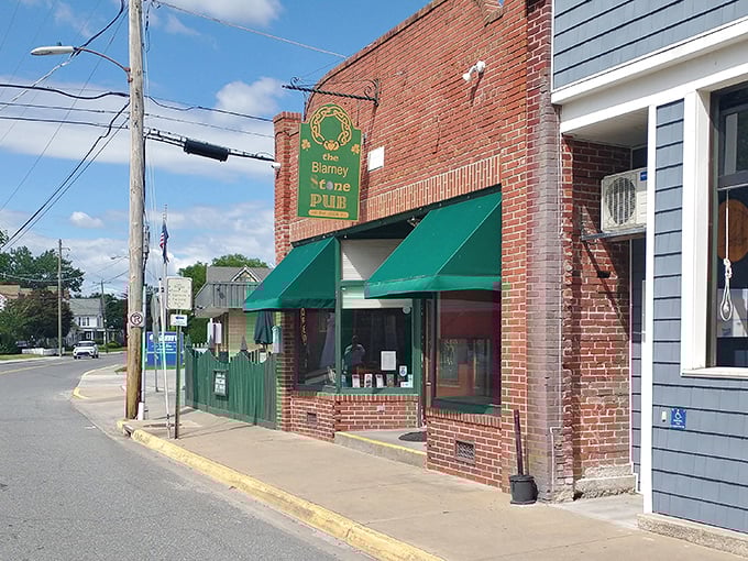 The Blarney Stone Pub's classic brick exterior and green awnings promise the kind of evening where stories get better with each telling.