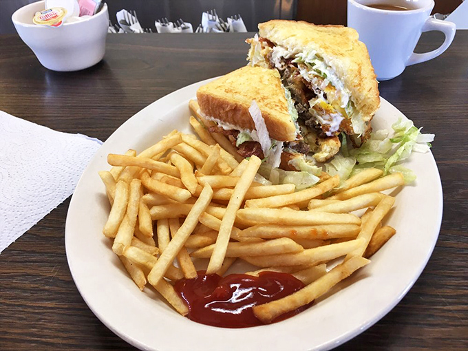 This sandwich isn't messing around. Golden toast, perfect filling ratio, and fries that could make a Frenchman weep with joy.