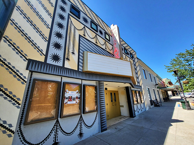 The Colfax Theater's Art Deco façade transports you to Hollywood's golden age—when movies were events and popcorn didn't require a loan.