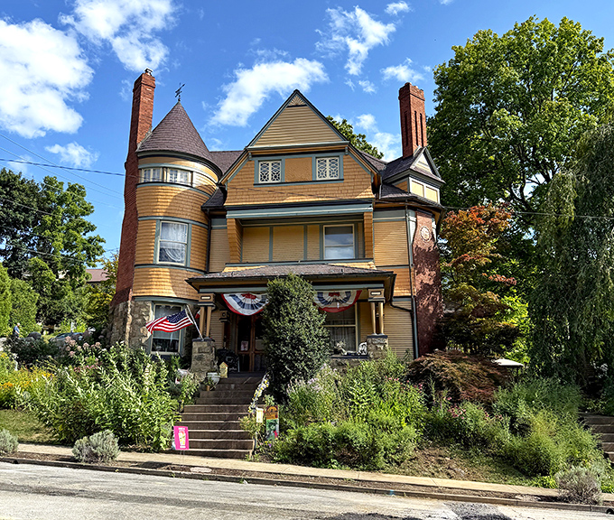 Sunshine yellow Victorian grandeur that screams "photograph me!" This stunning bed and breakfast sports the kind of wraparound porch that demands morning coffee and evening cocktails.