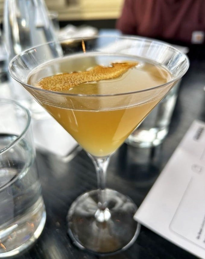A cocktail so elegant it makes you sit up straighter. That floating citrus peel isn't just garnish&mdash;it's aromatherapy for your taste buds.