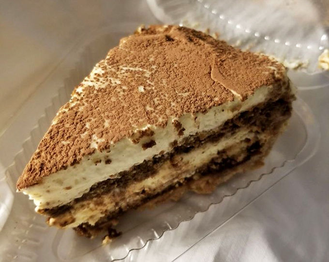 Layers of coffee-soaked goodness dusted with cocoa create a tiramisu that would make Italian grandmothers nod in approval. Comfort in every forkful.