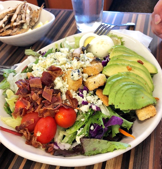 A salad that doesn't feel like punishment. Fresh greens, bacon, blue cheese, avocado, and egg create the rare healthy option you'll actually crave again.