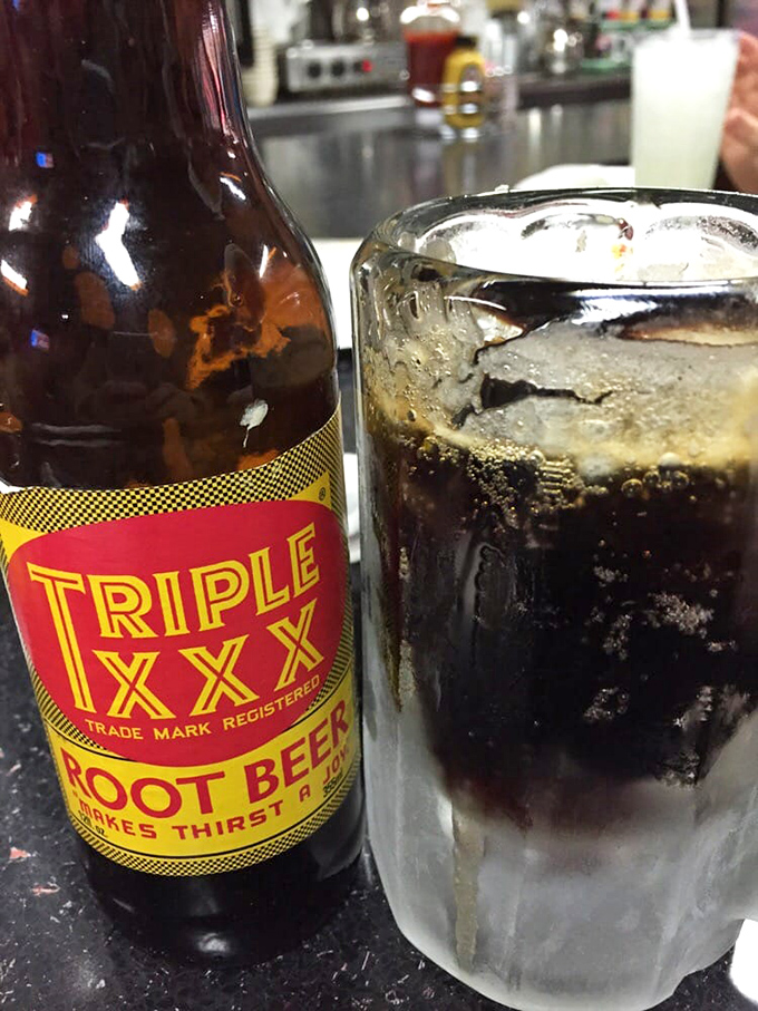 Triple XXX root beer—the perfect companion to diner fare. That frosty mug isn't just a vessel; it's part of the experience.
