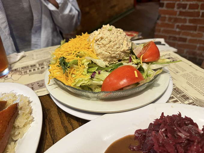 A garden of fresh vegetables surrounding potato salad like a moat around a delicious castle. German food isn't all meat&mdash;sometimes there's cheese on the vegetables!