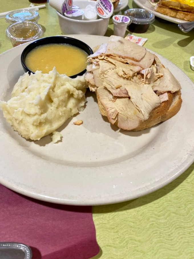 Turkey sliced thin enough to read through, served with mashed potatoes and gravy. Thanksgiving doesn't have to wait for November at Jack's.