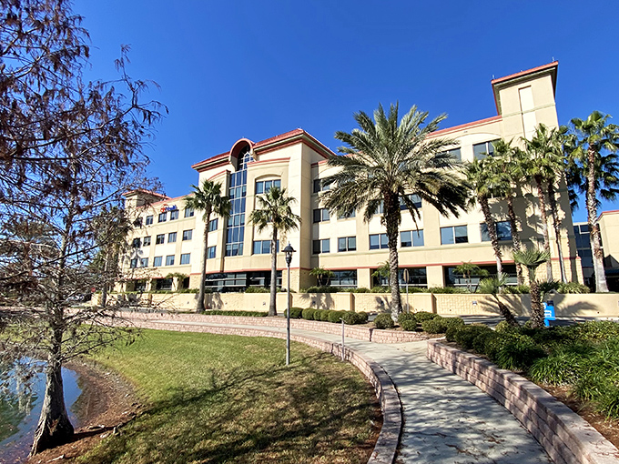 UF Health Leesburg Hospital's modern campus nestled alongside water reminds us that healing environments matter&mdash;palm trees included at no extra charge.