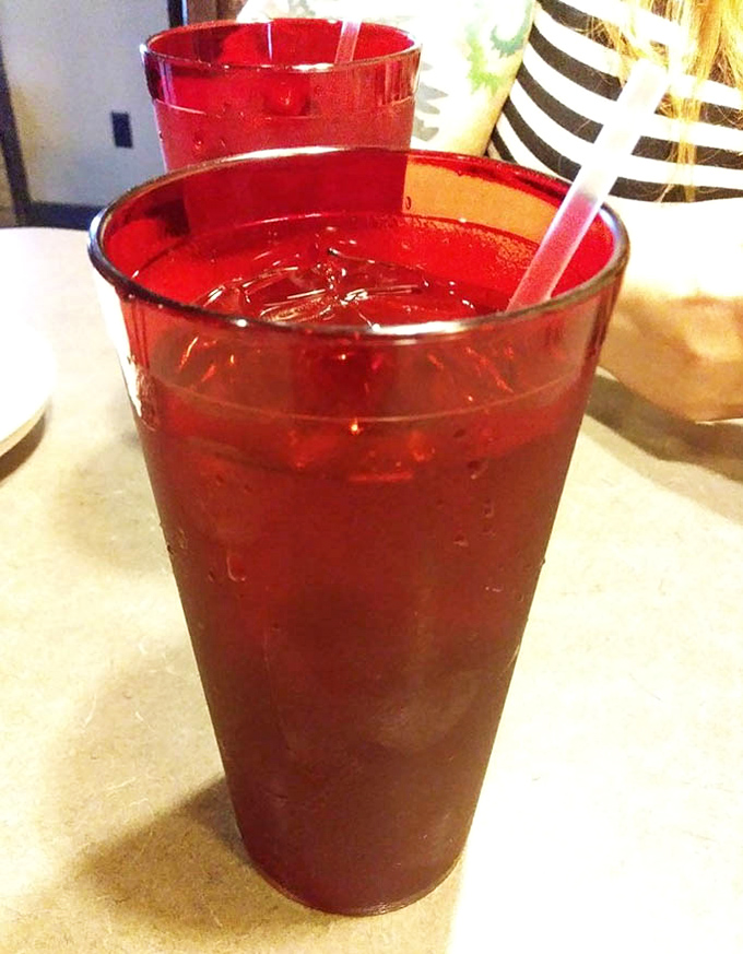 The ruby-red unsweetened tea – refreshingly straightforward in a world of overly complicated beverages with names longer than some novels.