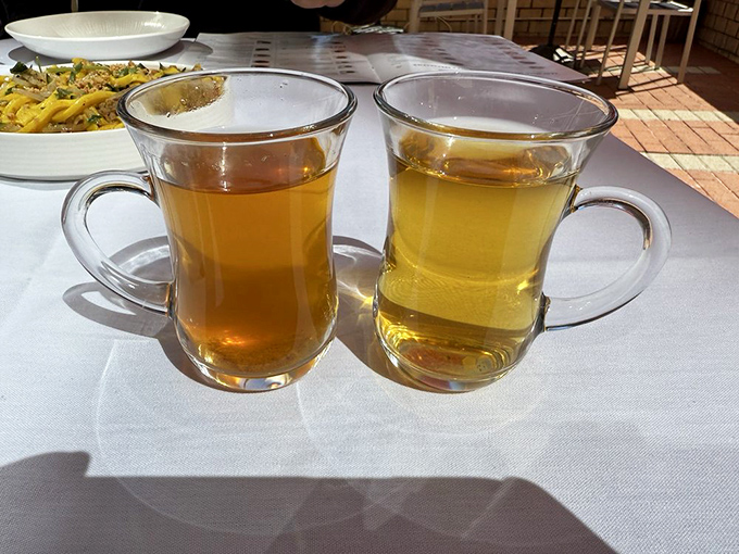 Two varieties of traditional tea&mdash;one amber, one golden&mdash;offer the perfect companions to cut through rich flavors and cleanse the palate between bites.