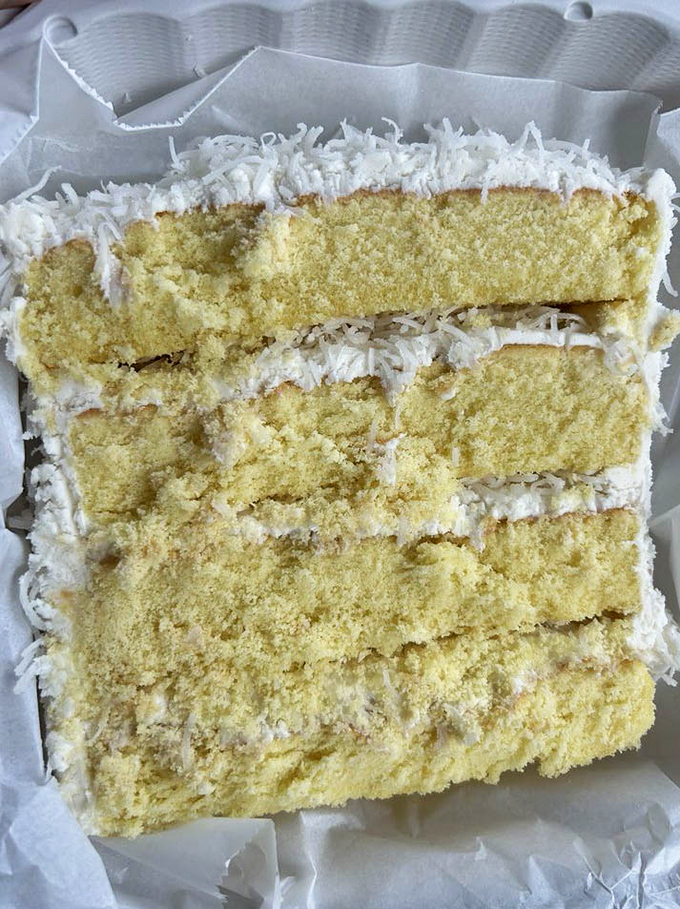 Coconut cake that looks like it belongs in a bakery window on a New York street corner&mdash;layer upon glorious layer.