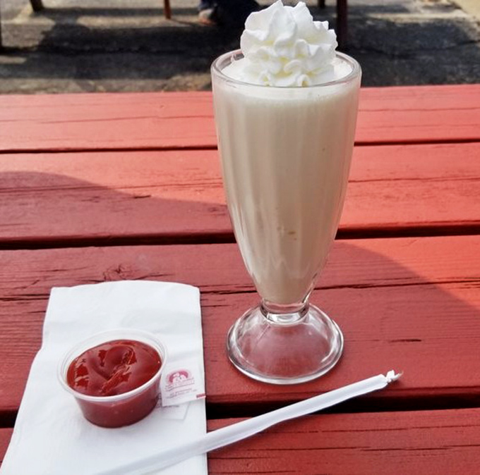 This milkshake isn't just thick&mdash;it's contemplating a career change to "concrete" while that whipped cream crown holds court.