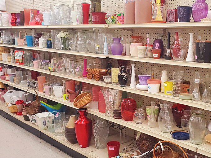 The glassware aisle sparkles with potential, each vase whispering stories of past centerpieces and future windowsill sunsets.