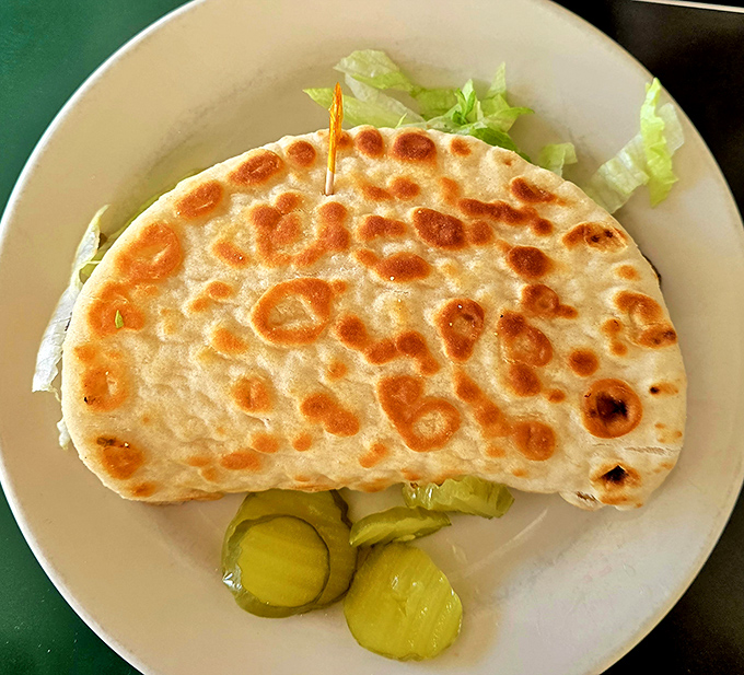 Even the veggie options shine&mdash;this grilled pita with fresh vegetables and pickles proves that meatless doesn't mean flavorless in this culinary time capsule.