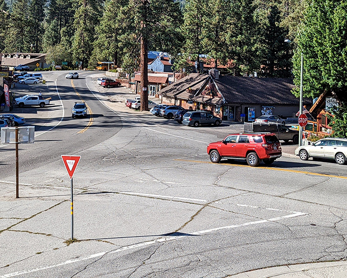 Rustic buildings and mountain roads converge at this quintessential alpine intersection. Yield signs here seem to say "slow down and enjoy the view."