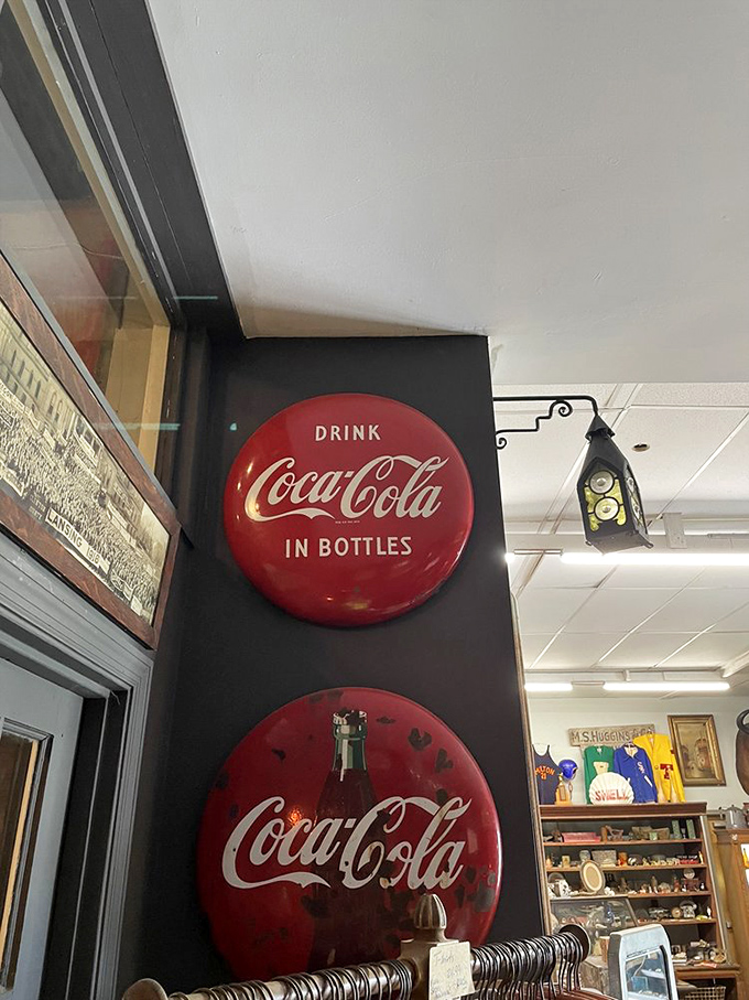 Classic Coca-Cola button signs remind us of simpler times when soda came in glass bottles and advertising was an art form.