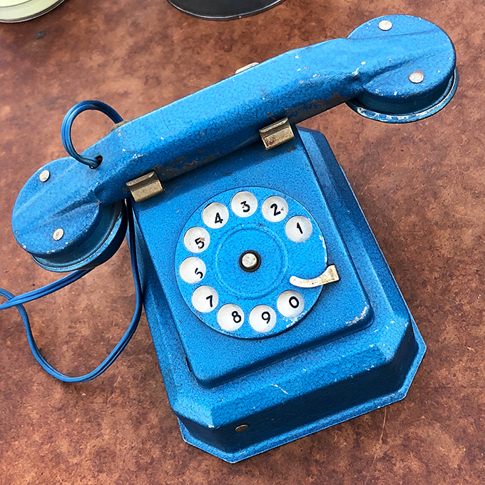 This adorable blue toy telephone whispers tales of rotary-dialing days when "hanging up" was a literal action and patience was built into communication.