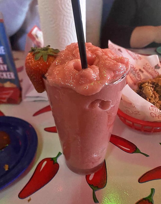A strawberry daiquiri topped with fresh fruit—the perfect sweet counterpoint to all that savory fried goodness. Refreshment never looked so good.