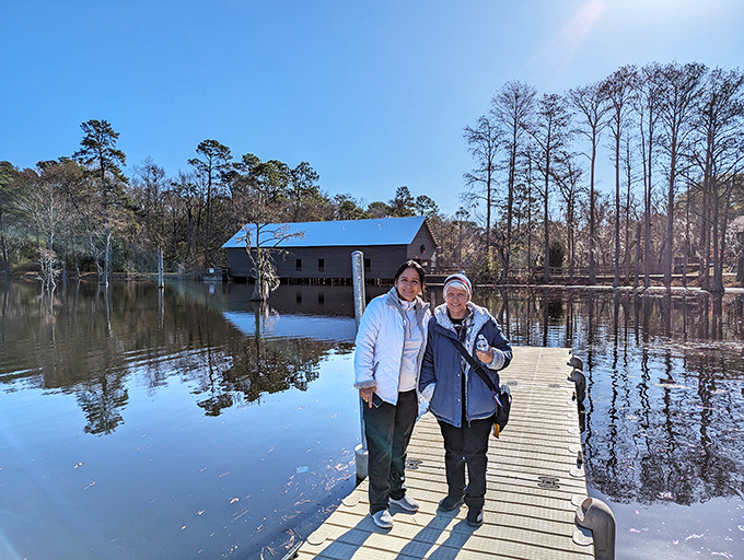 Making memories on the boardwalk: visitors pause to capture the perfect moment where history, water, and sky create postcard-worthy magic.
