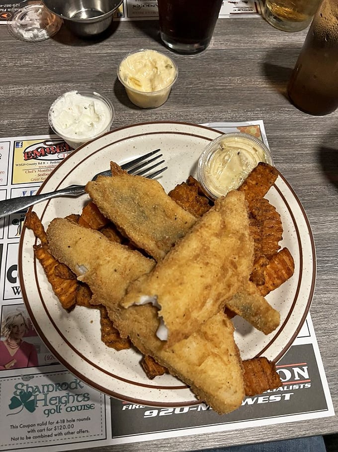 Golden-fried perfection that would make Lake Michigan's fish population nervous. Wisconsin's Friday fish fry tradition at its crispy, delectable best.