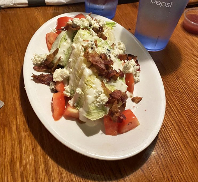 The wedge salad&mdash;that glorious throwback that never goes out of style. With bacon crumbles and blue cheese, it's the salad for people who don't "do" salads.