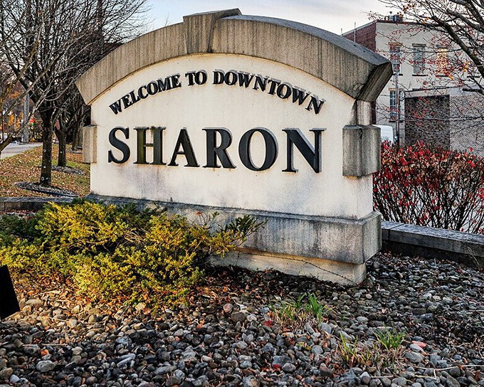 The "Welcome to Downtown Sharon" sign doesn't need neon or flash&mdash;its classic stone construction speaks to the city's understated charm.