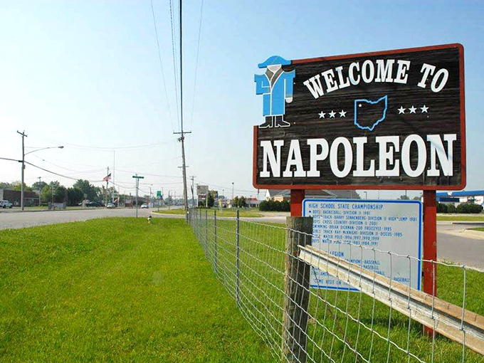 Napoleon's welcome sign proudly displays the town's achievements, proving that sometimes the biggest accomplishments come from the smallest places.